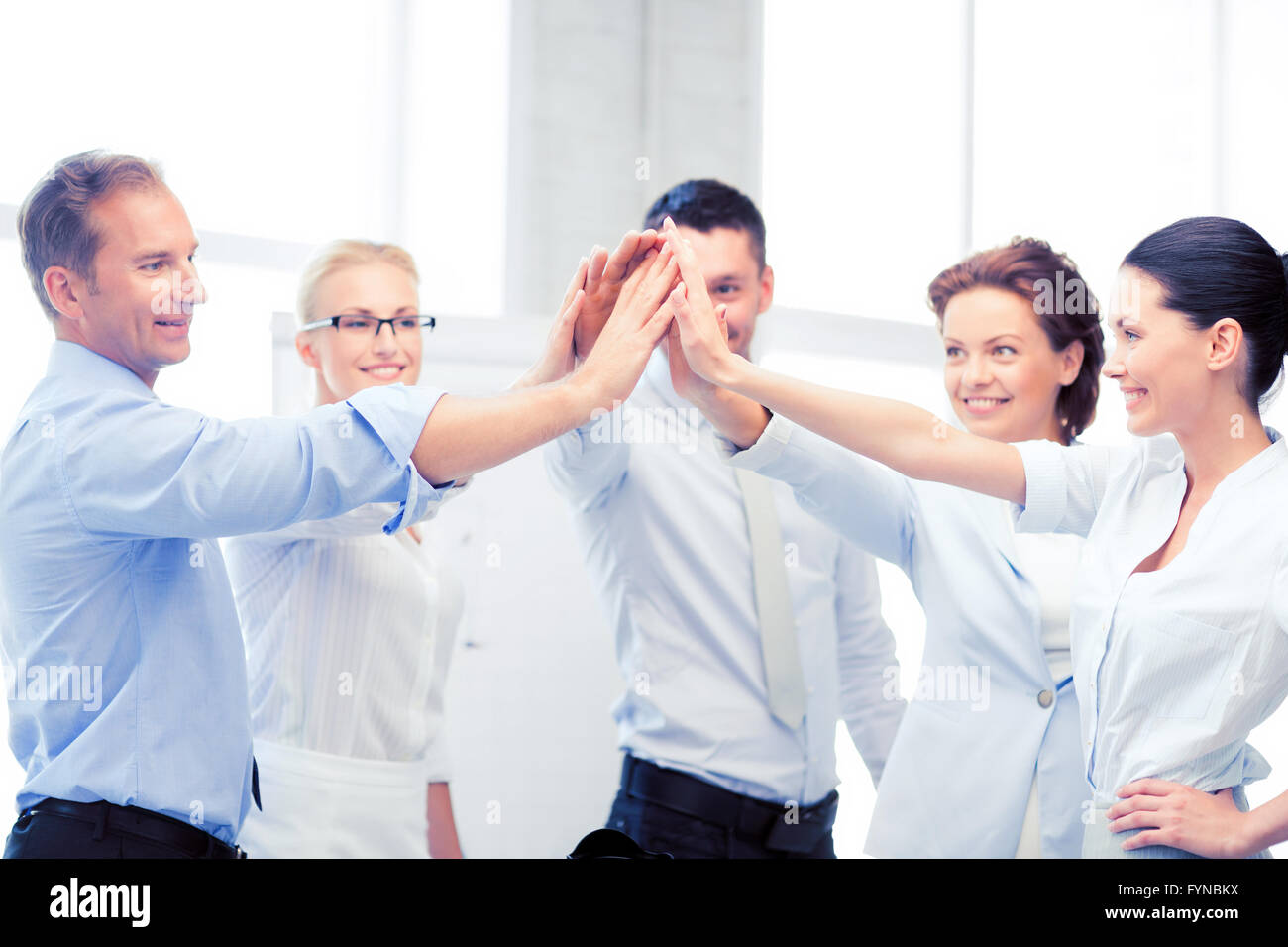 business team celebrating victory in office Stock Photo - Alamy