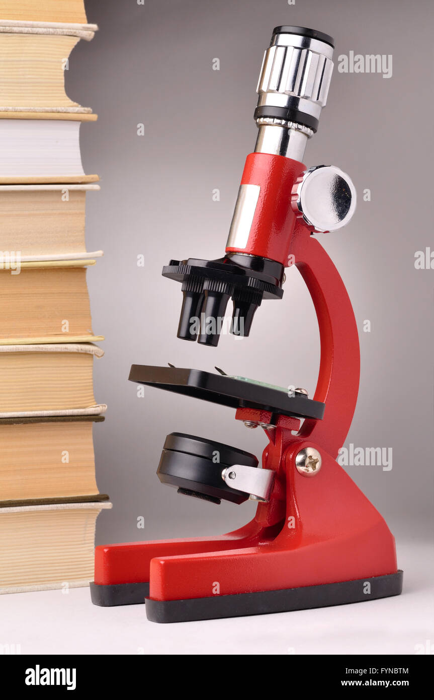 books and microscope, scientific or educational concept Stock Photo - Alamy