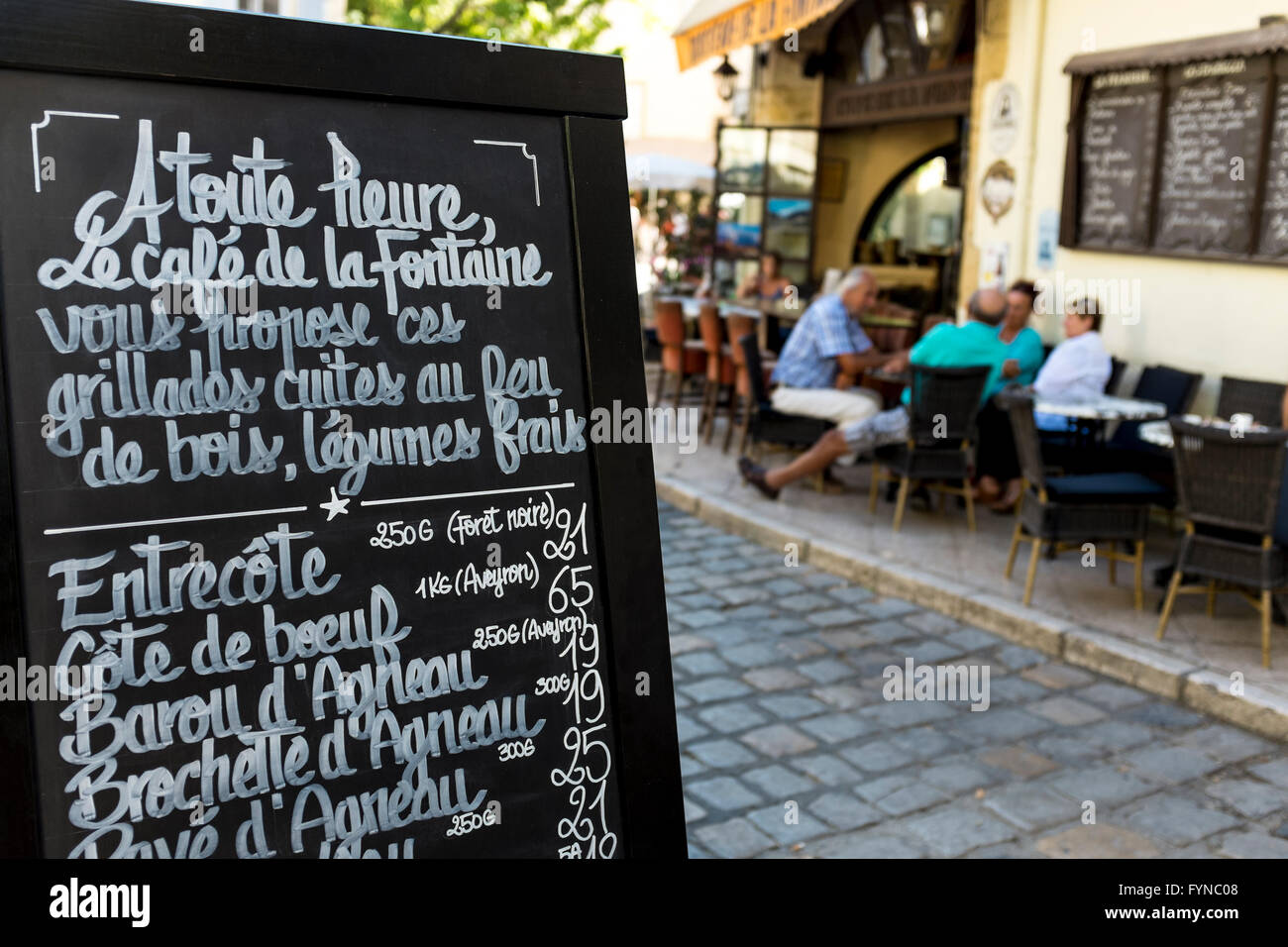 Handwritten menu on a blackboard outside of a pavement cafe restaurant ...