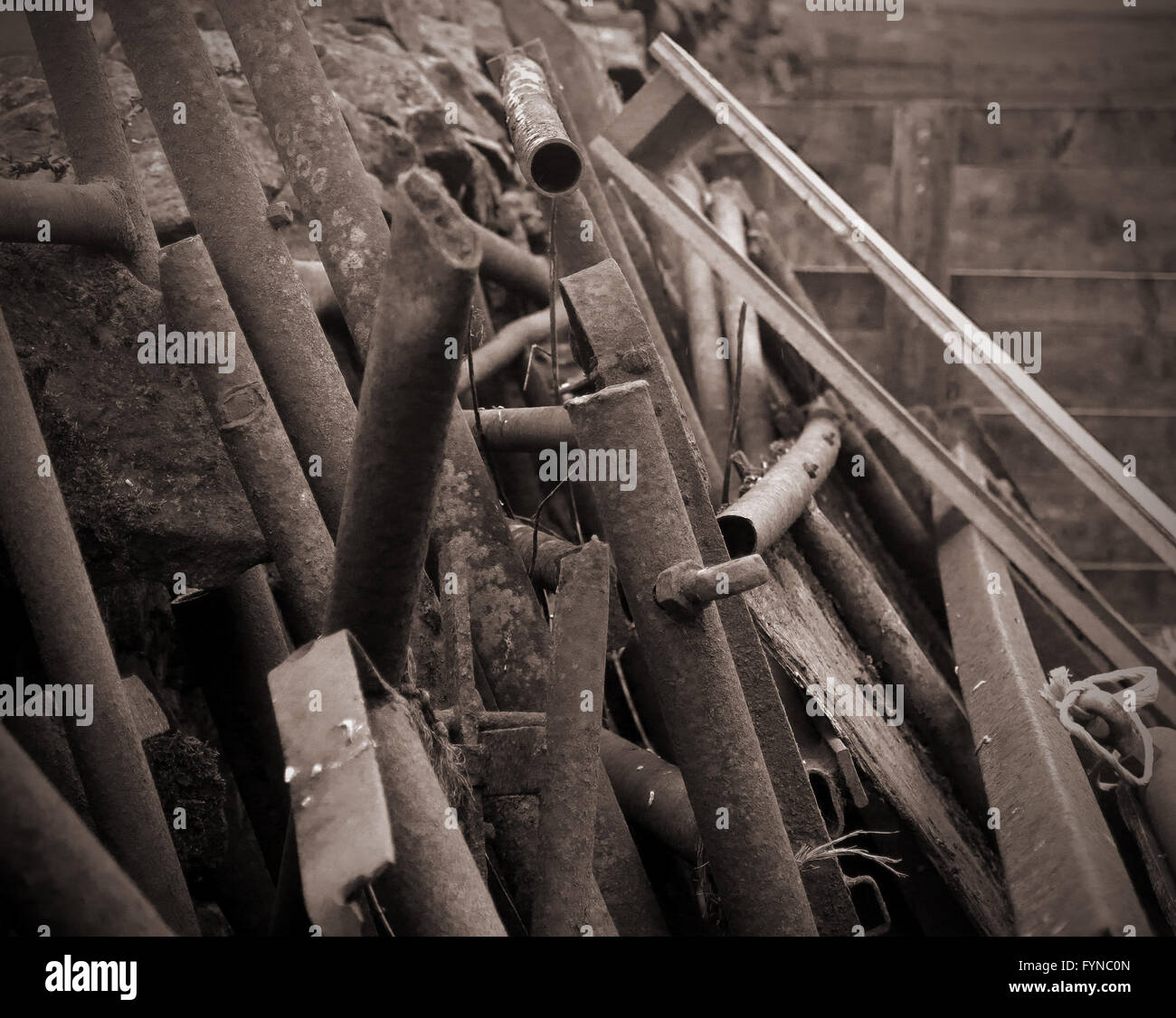 Scrap Metal lying against a dry stone wall on a rural sheep farm in ...