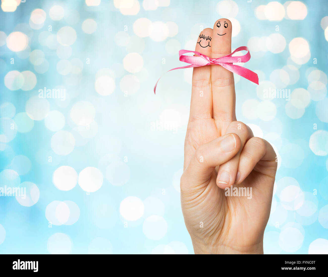 close up of two fingers tied by pink bow knot Stock Photo - Alamy