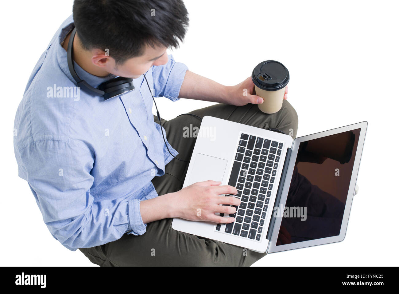 Young man using laptop Stock Photo - Alamy