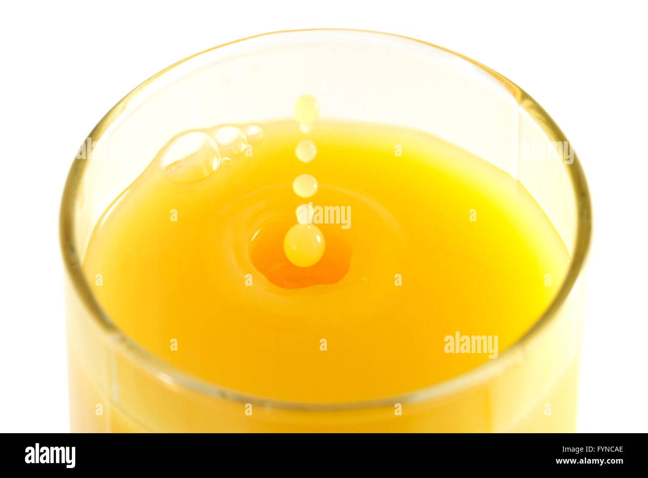 drops falling down to orange juice Stock Photo - Alamy