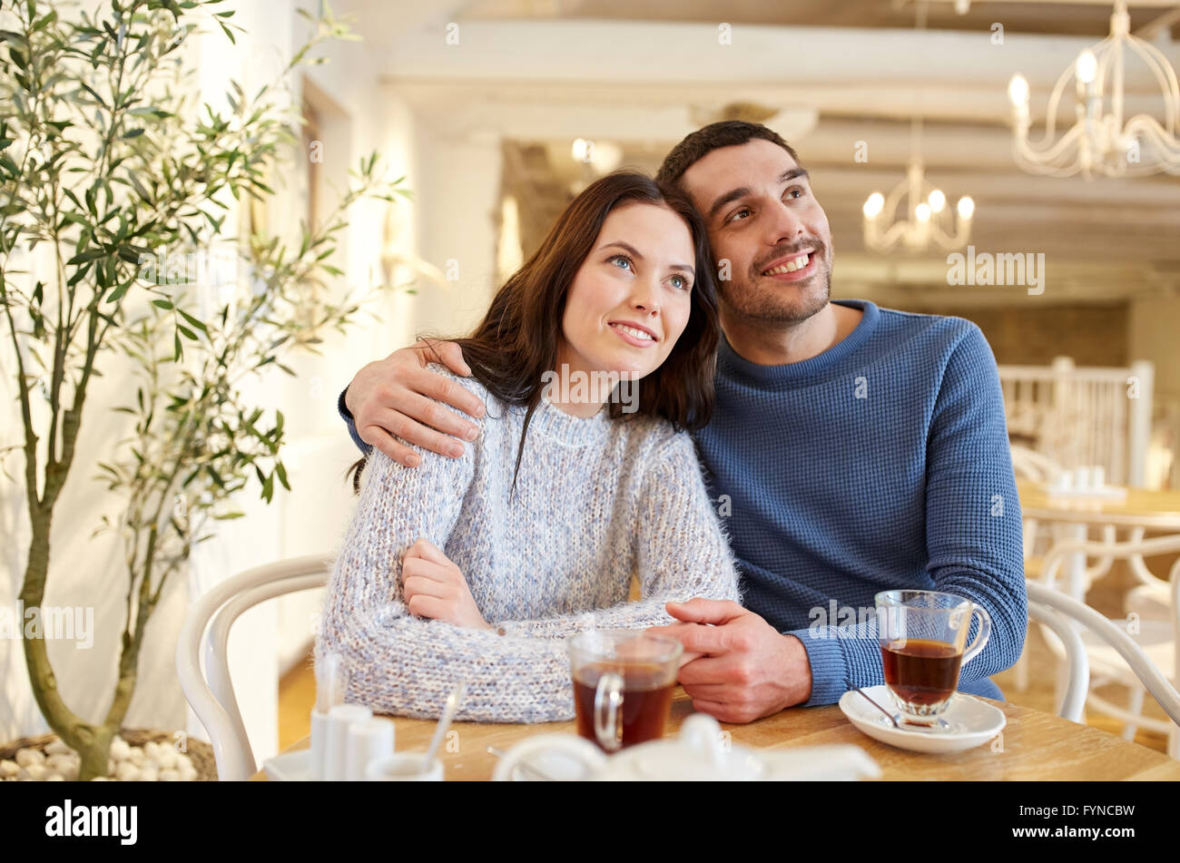 happy couple drinking tea at restaurant Stock Photo - Alamy