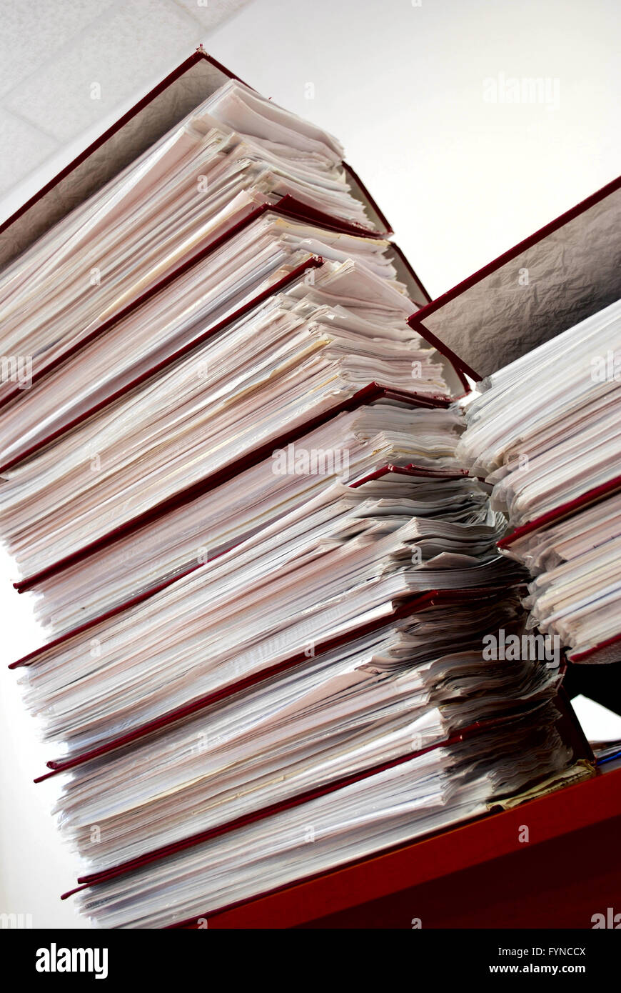 Stack of folders on a table Stock Photo - Alamy