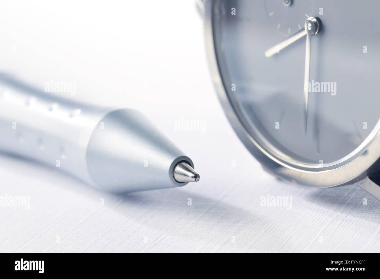 watch and pen closeup Stock Photo - Alamy