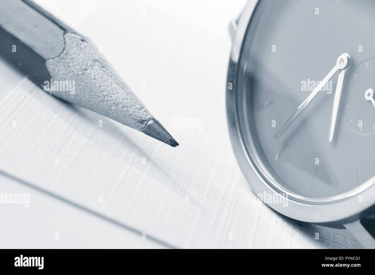 watch and pencil closeup Stock Photo - Alamy
