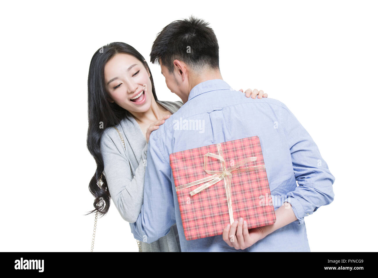 Young man surprised girlfriend with a gift Stock Photo - Alamy