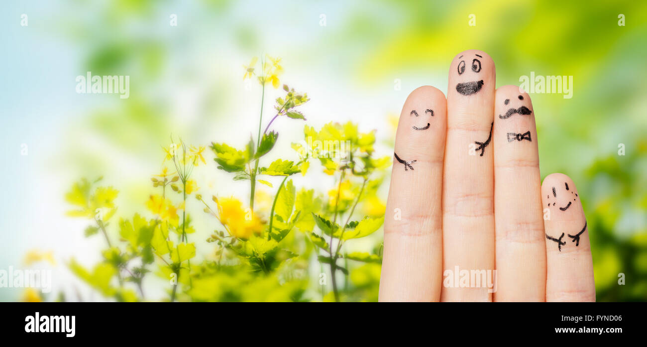 close up of fingers with smiley faces over nature Stock Photo - Alamy