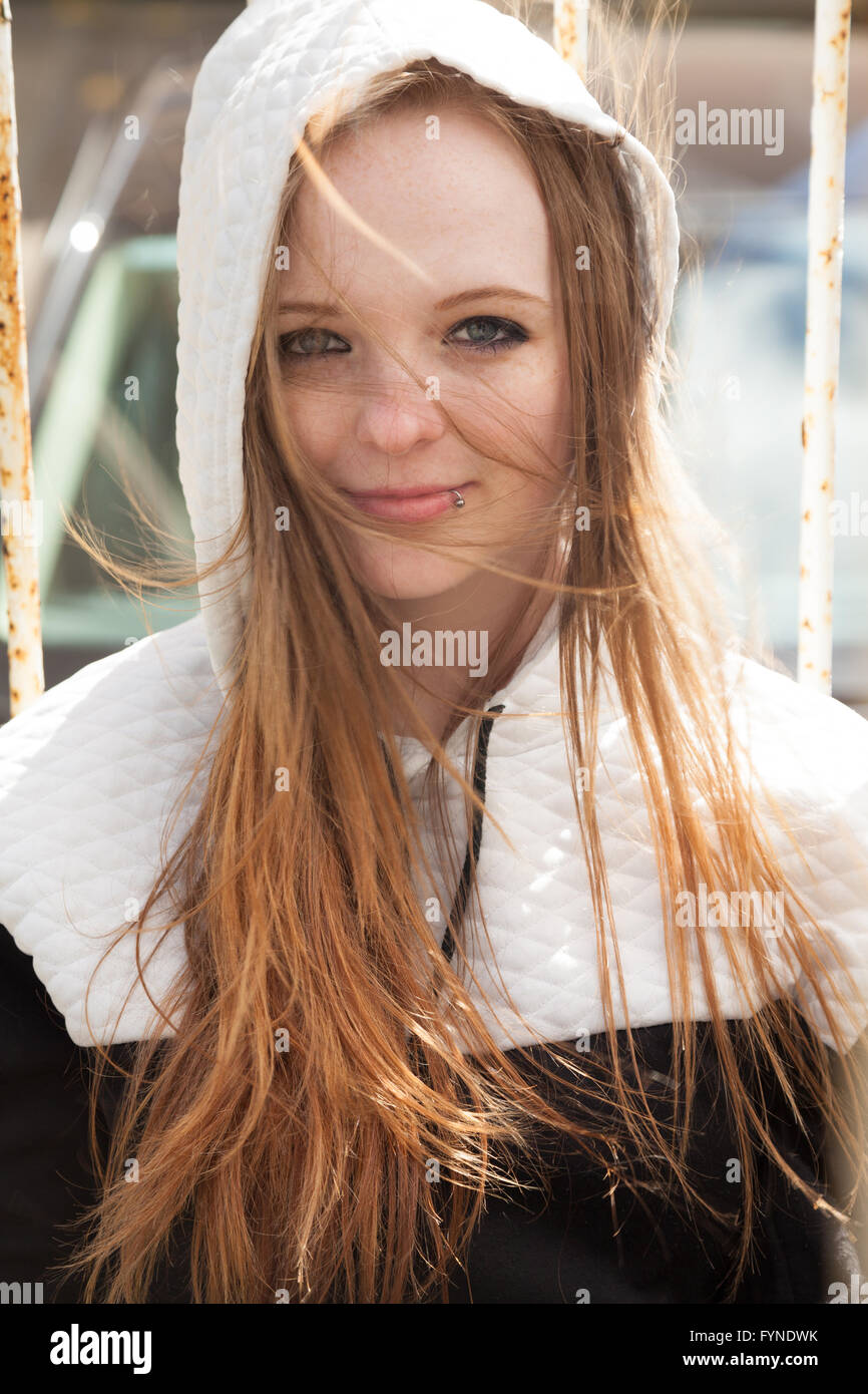 A red headed woman with long wind blown messy hair Stock Photo - Alamy