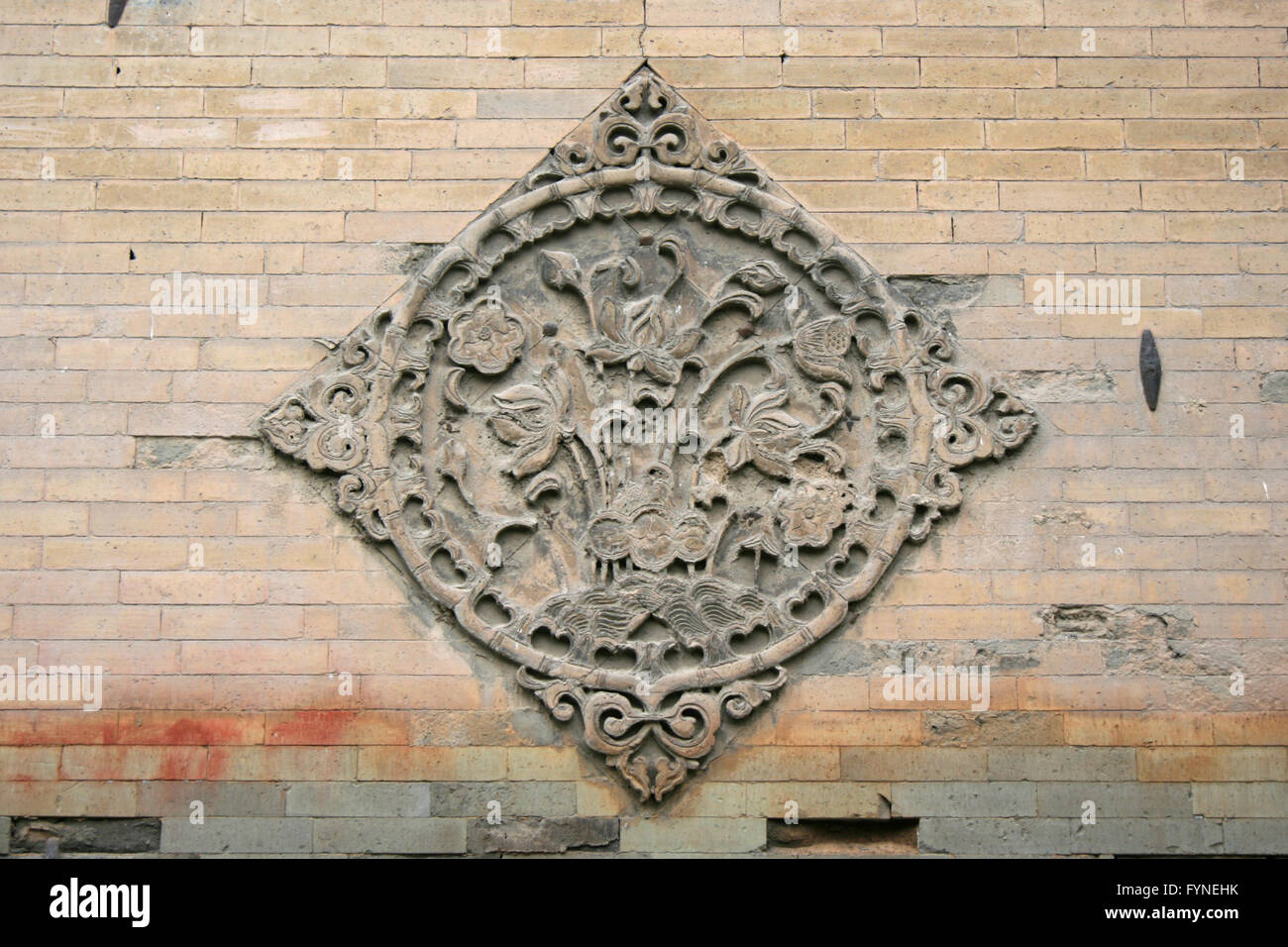 Sculptured floral patterns decorate a wall closed to the great mosque ...