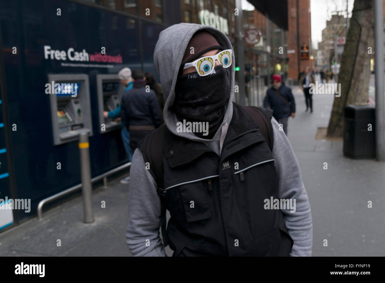 Man wearing a black mask across his face and sunglasses with cartoon ...