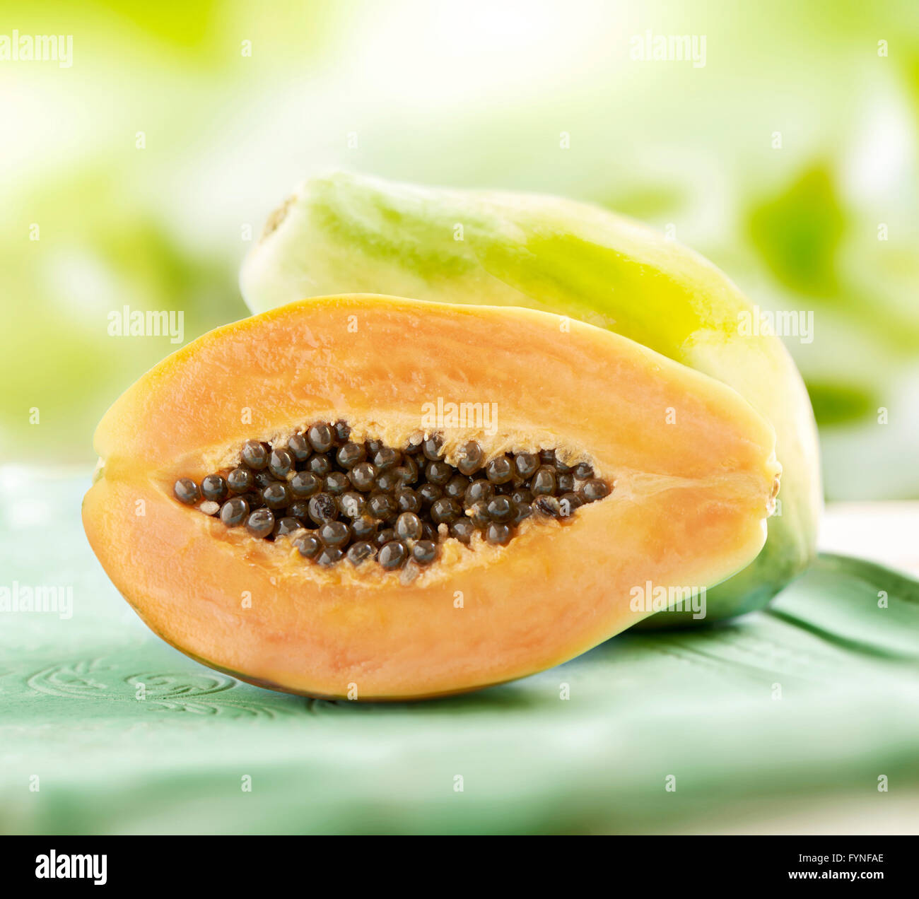 Food Still Life of Cut Papaya Facing Camera and Showing Seeds Inside on ...