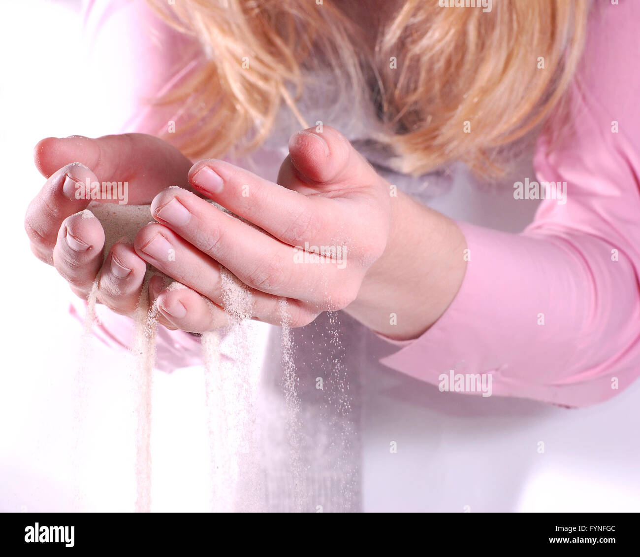 Woman hands trying to hold sand Stock Photo - Alamy