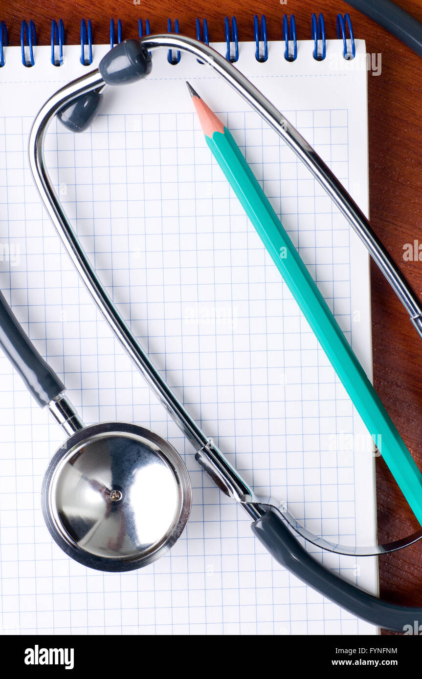 stethoscope with pen on a notepad Stock Photo - Alamy
