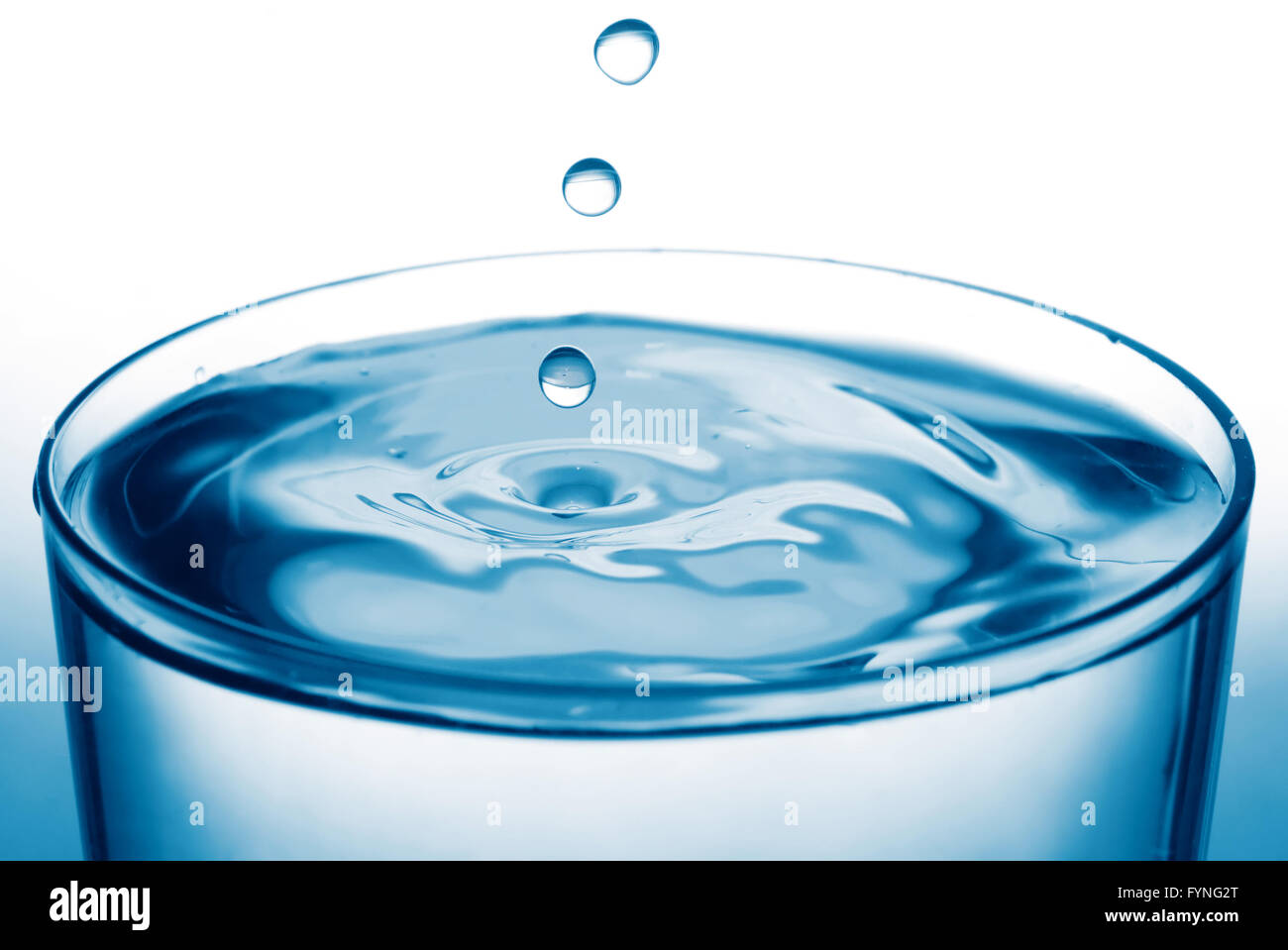 drops falling down into a glass Stock Photo - Alamy