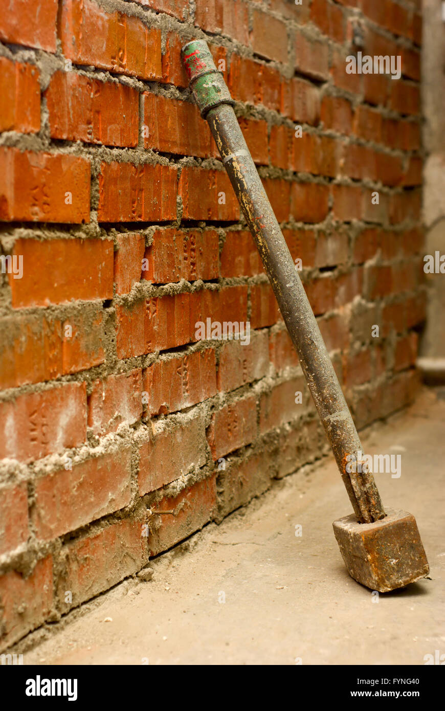 brick wall and an iron hummer Stock Photo - Alamy