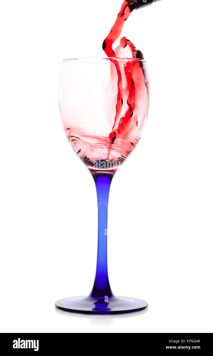 Red wine flowing from a green bottle to a glass. Isolated on whi Stock ...