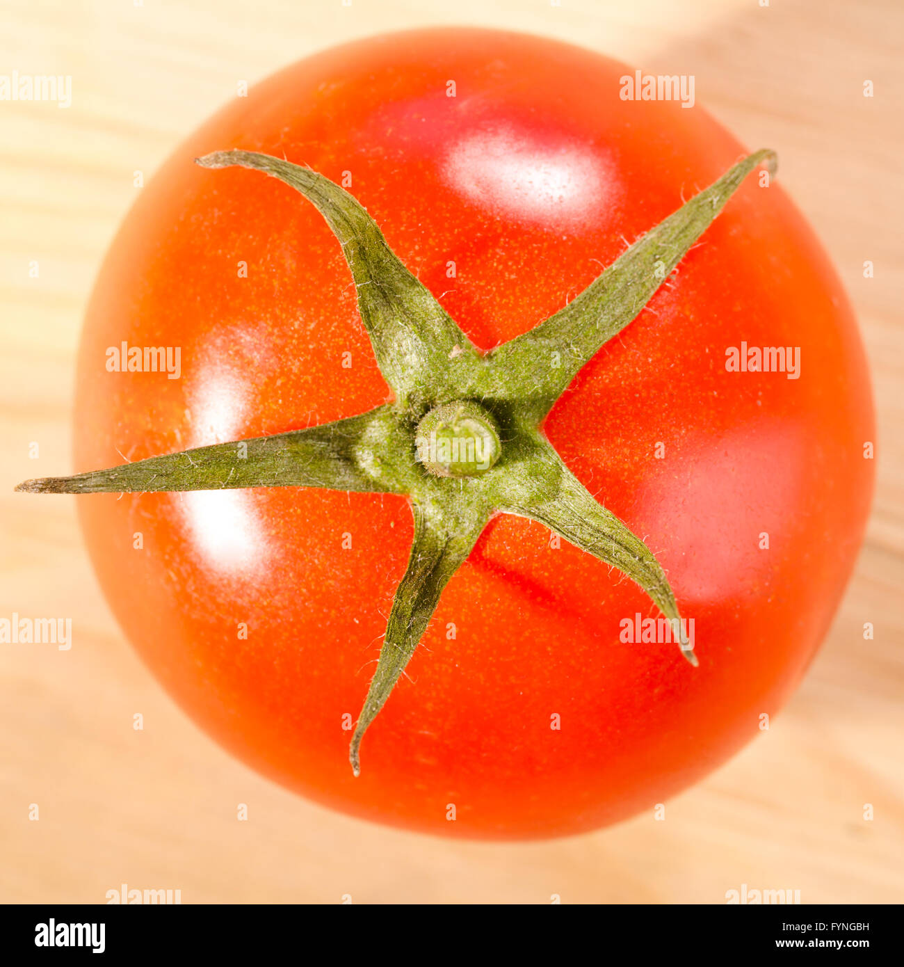 One green tomato above one red tomato hi-res stock photography and ...