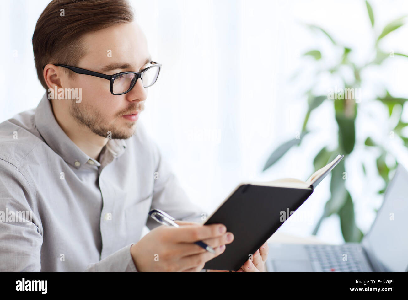 Male student book pen hi-res stock photography and images - Alamy