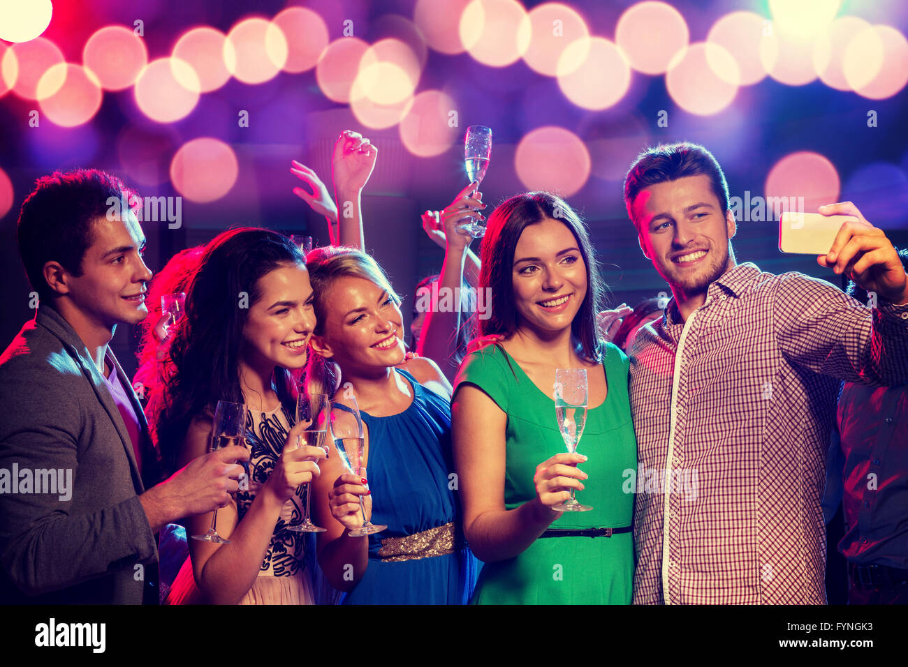 friends with glasses and smartphone in club Stock Photo - Alamy