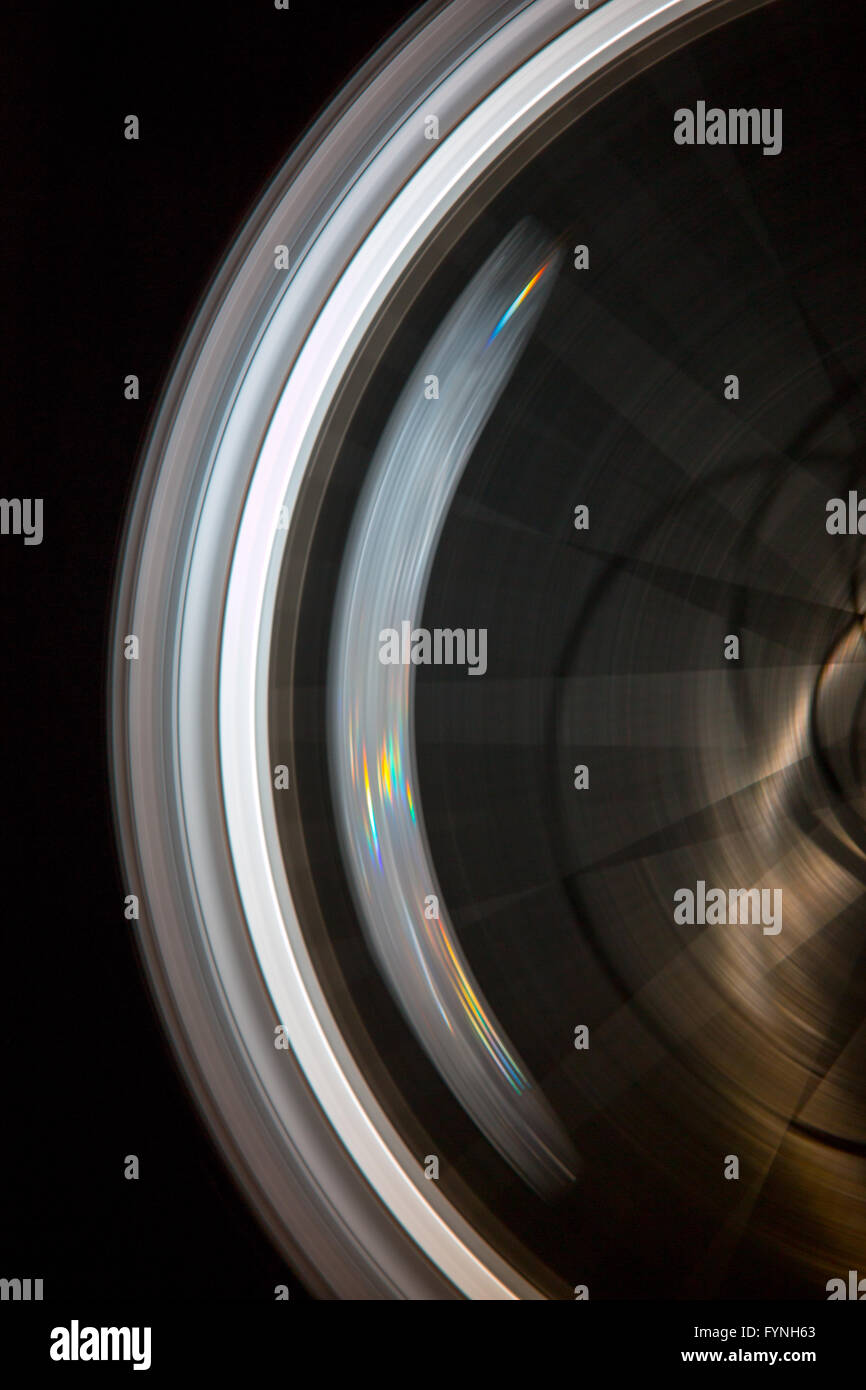 A spinning round bicycle wheel in motion while the safety reflector ...