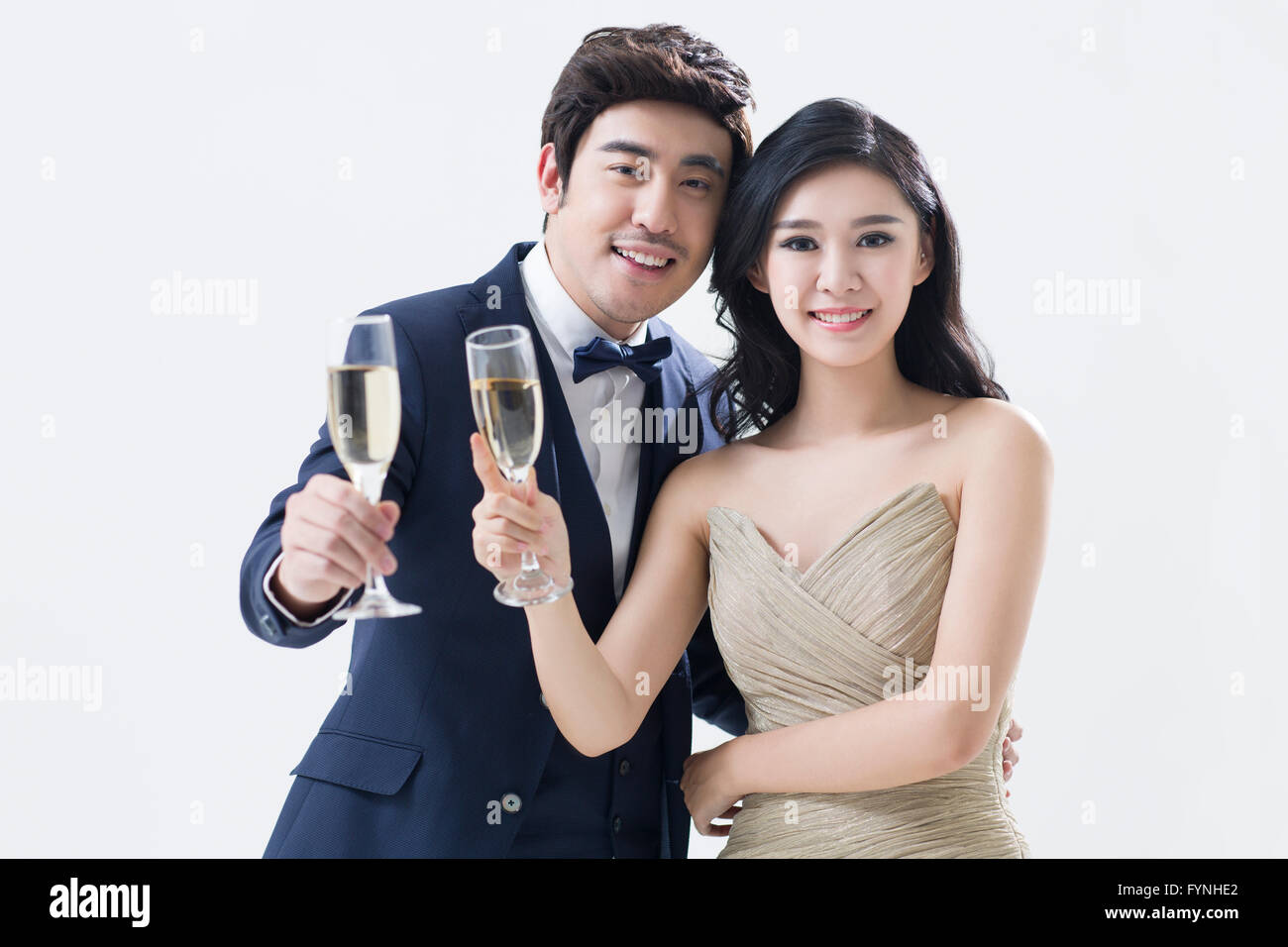 Elegant young couple drinking champagne Stock Photo - Alamy