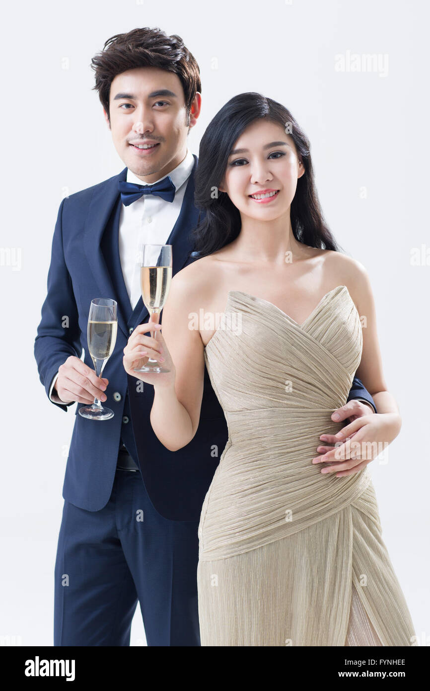 Elegant young couple drinking champagne Stock Photo - Alamy