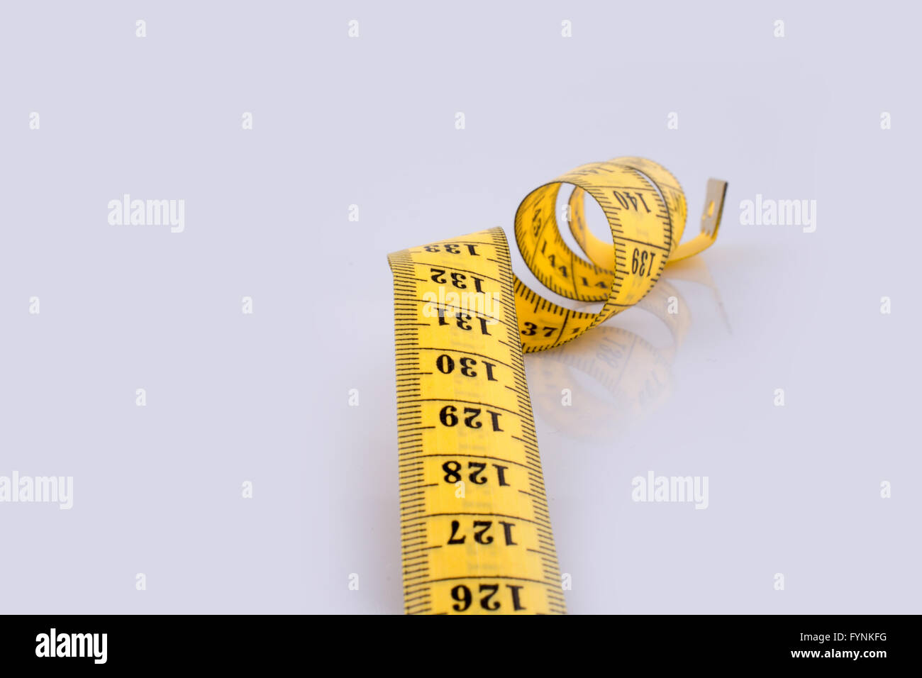 Measuring tape on a white background Stock Photo - Alamy