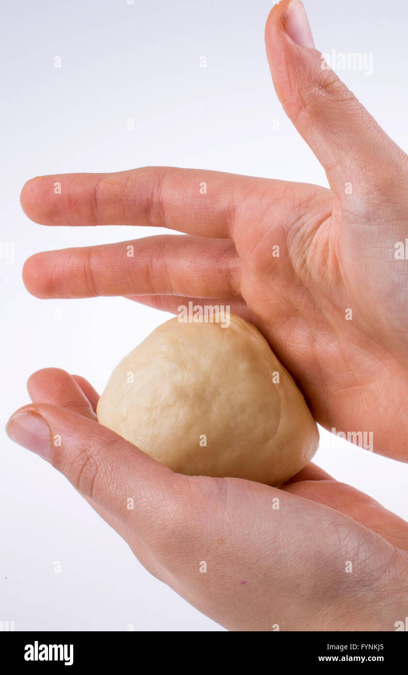 Hand holding paste on a white background Stock Photo - Alamy