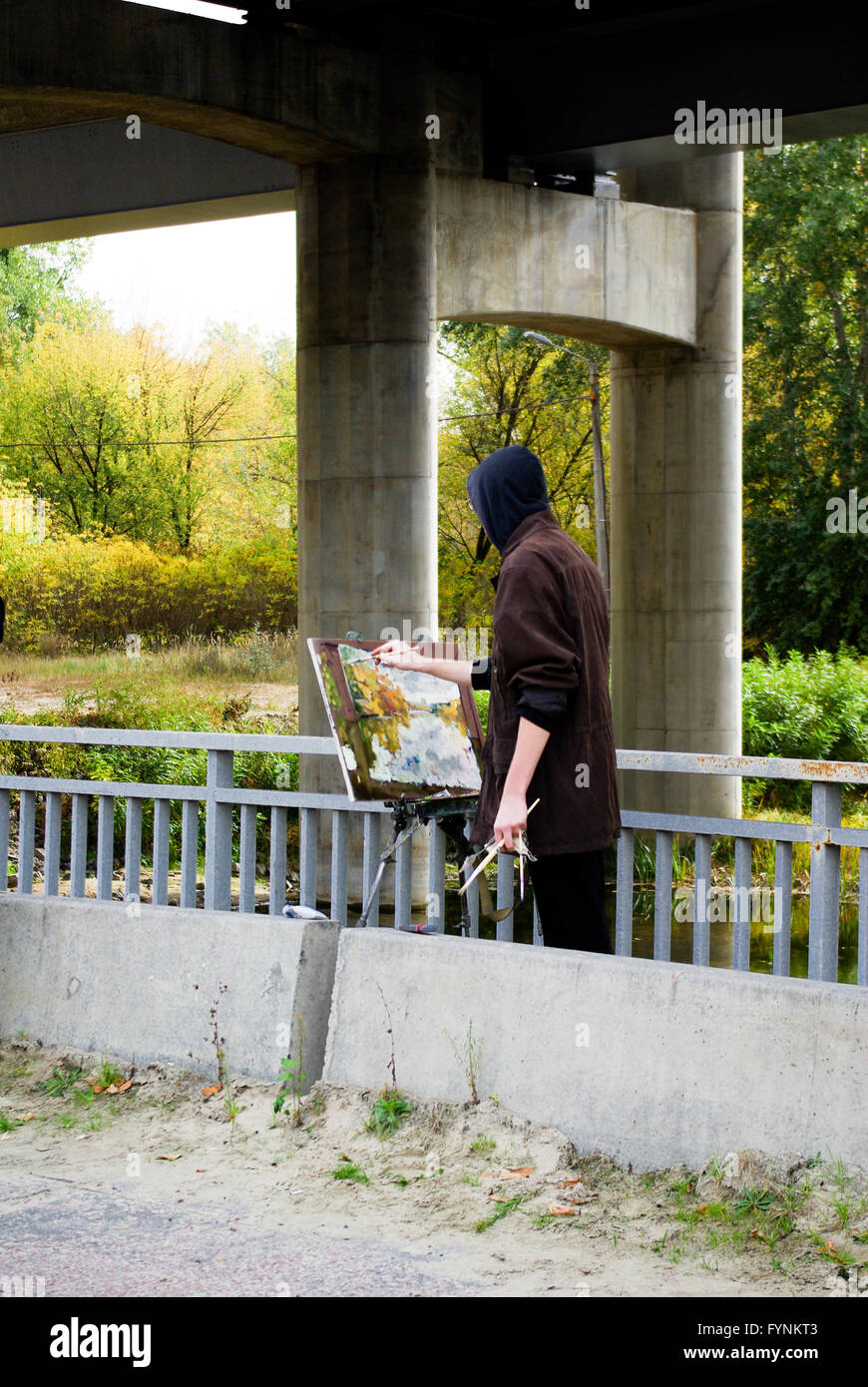 Man painting on his canvas in nature Stock Photo - Alamy