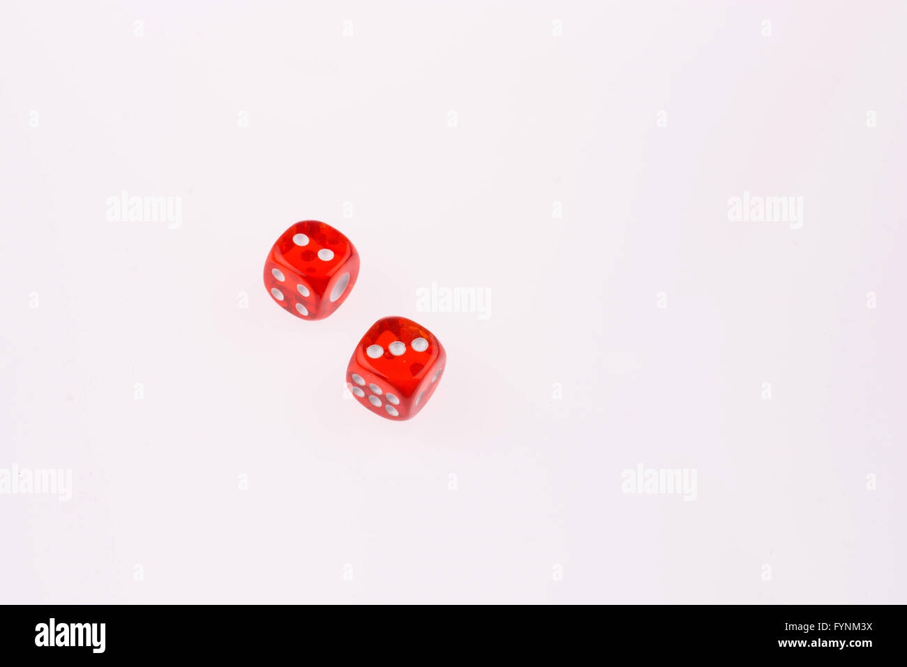 two red dice on a white background Stock Photo - Alamy