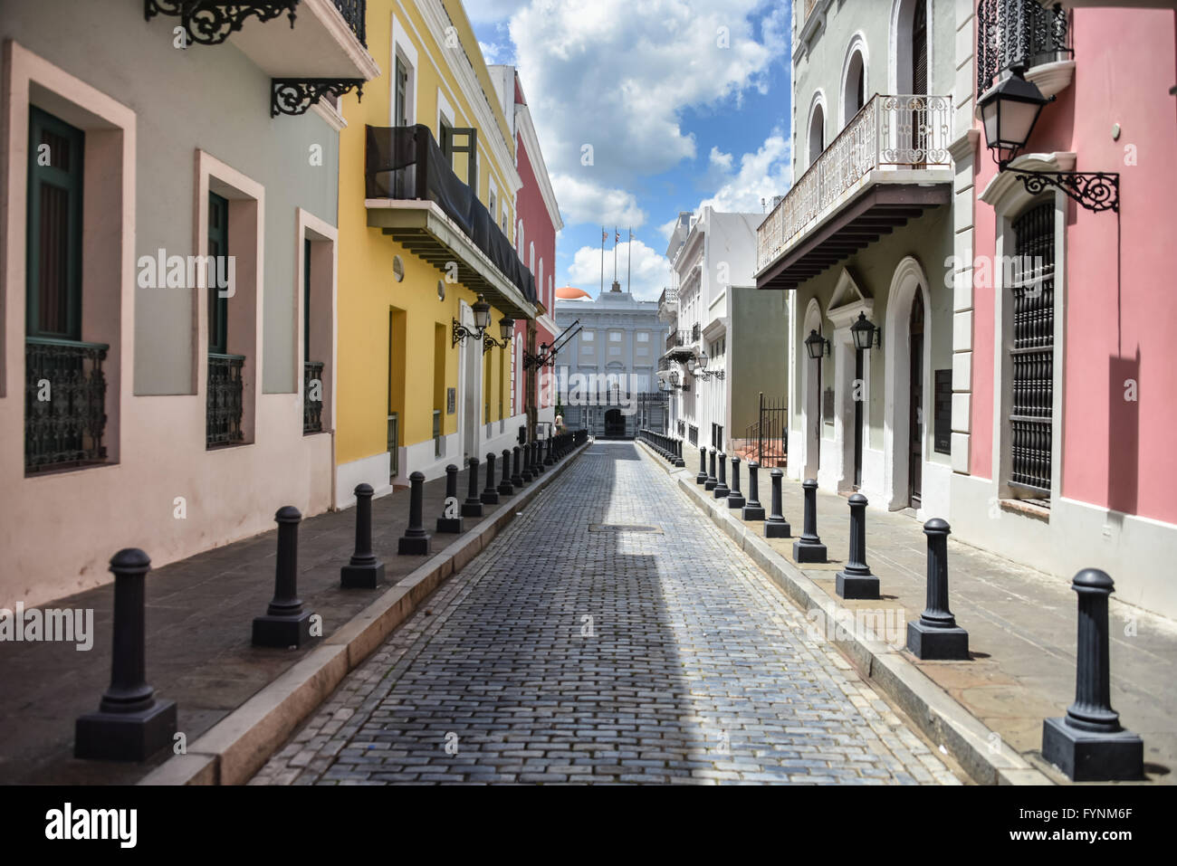 Pastel stucco buildings on Calle Fortaleza leading up to the Fortaleza ...