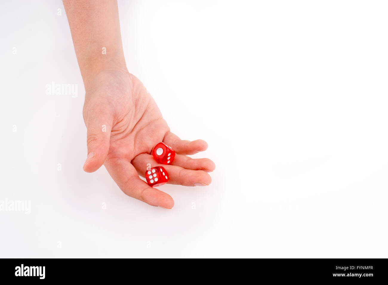 Hand holding red dice on a white background Stock Photo - Alamy