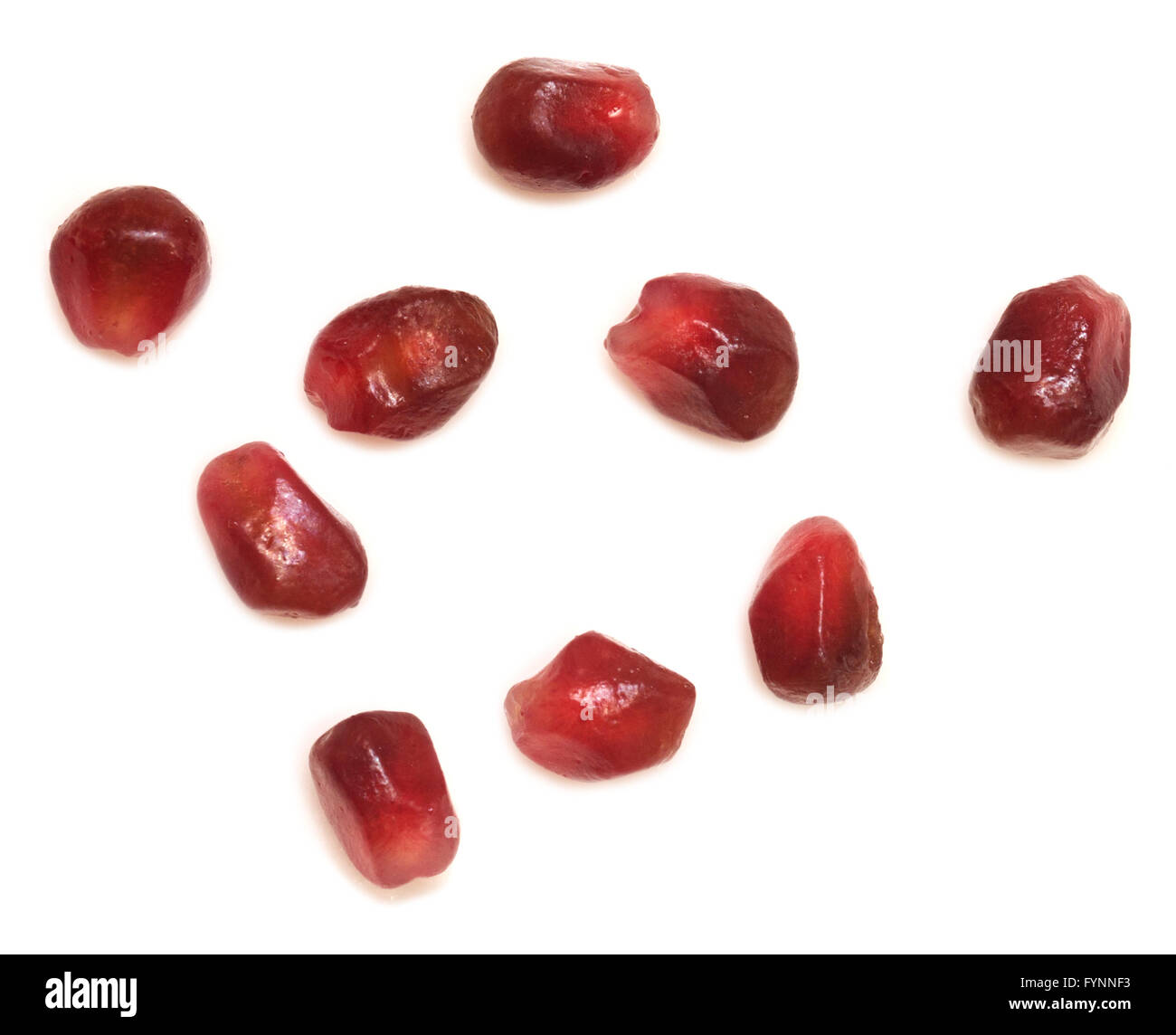 pomegranate seeds isolated on white background Stock Photo - Alamy