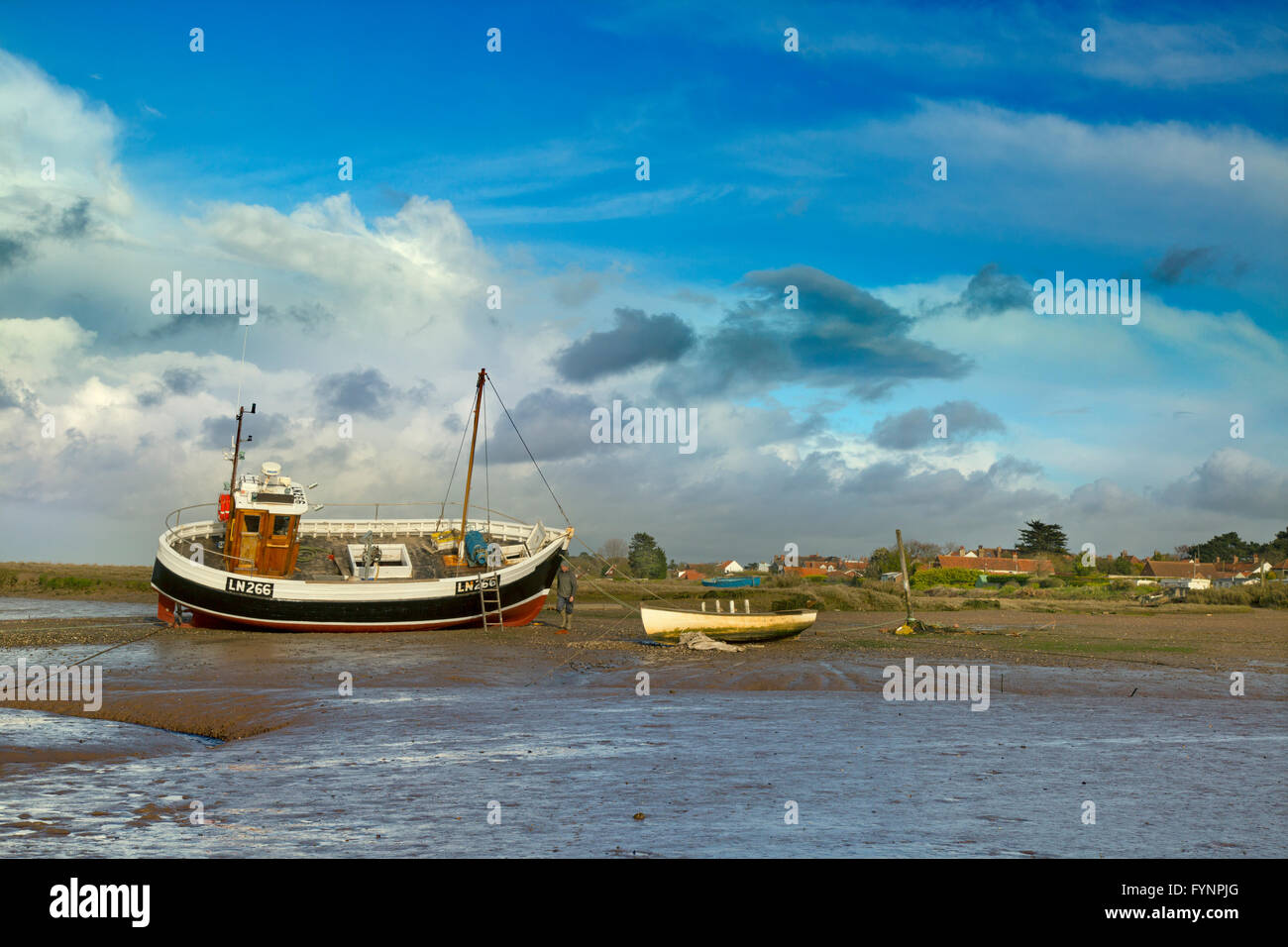 Fishing Boats Brancaster Staithe harbour at low tide Spring Norfolk UK ...