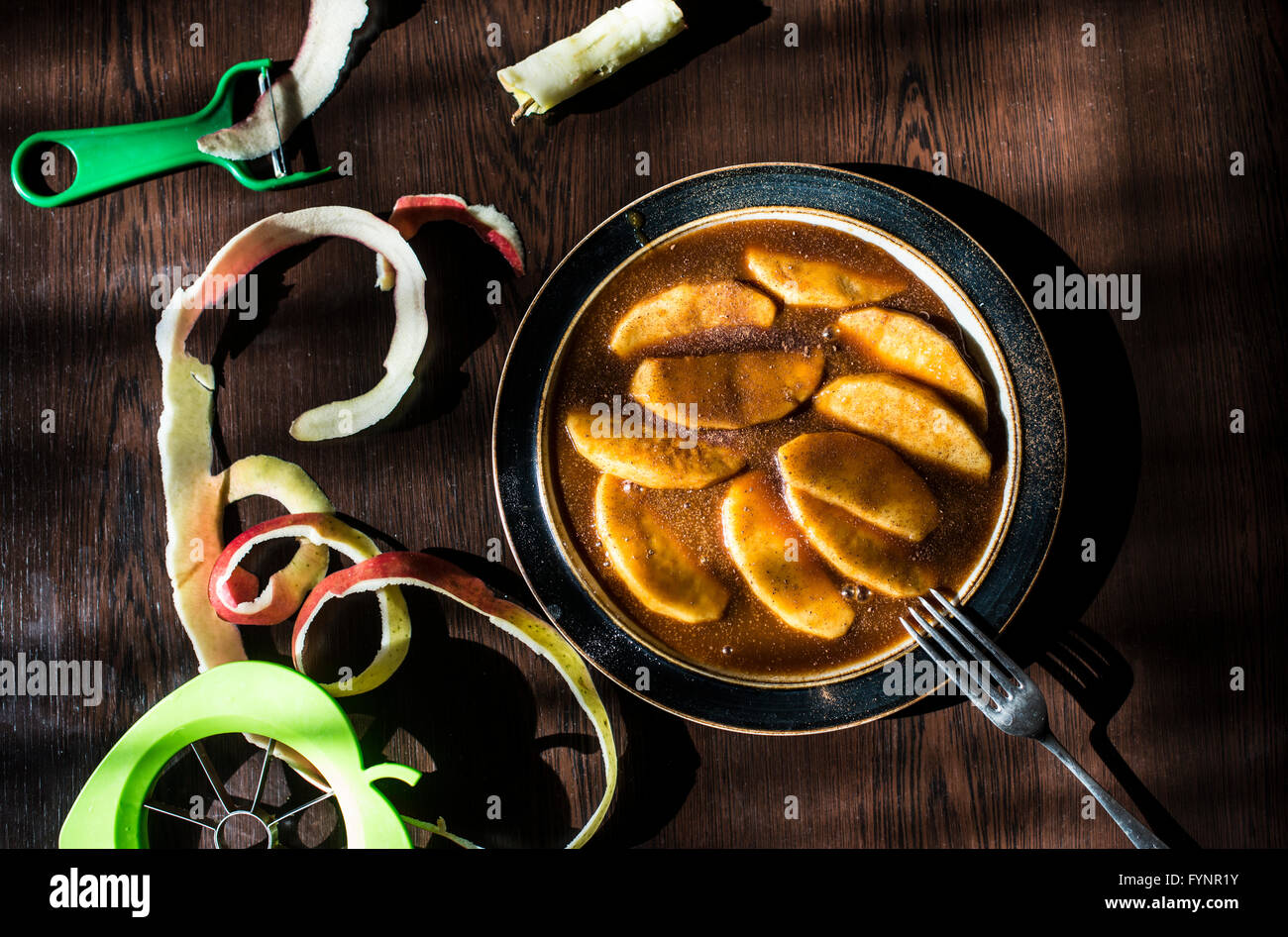 Apples in caramel. Natural light from window Stock Photo - Alamy
