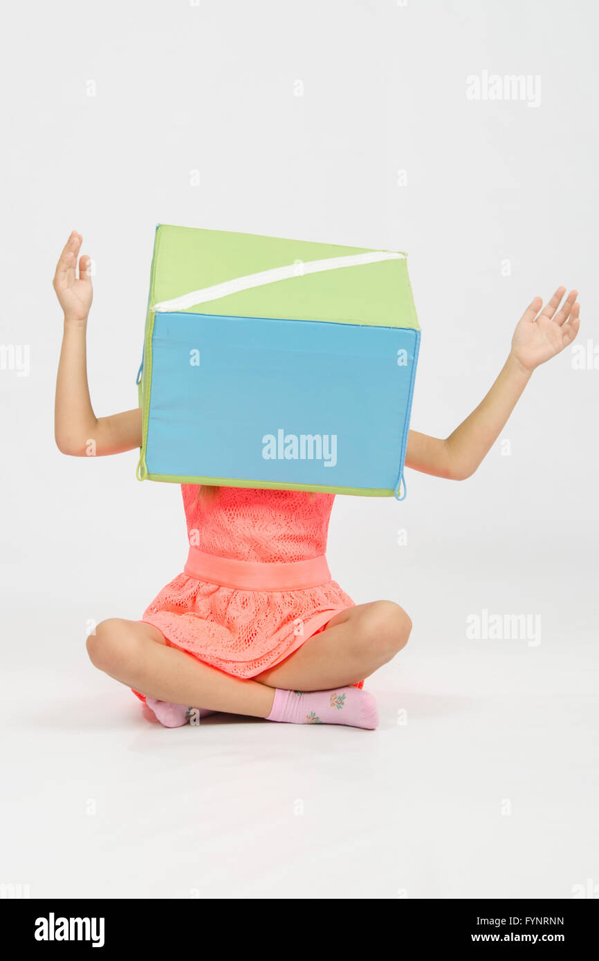The girl with a box on his head her arms Stock Photo - Alamy