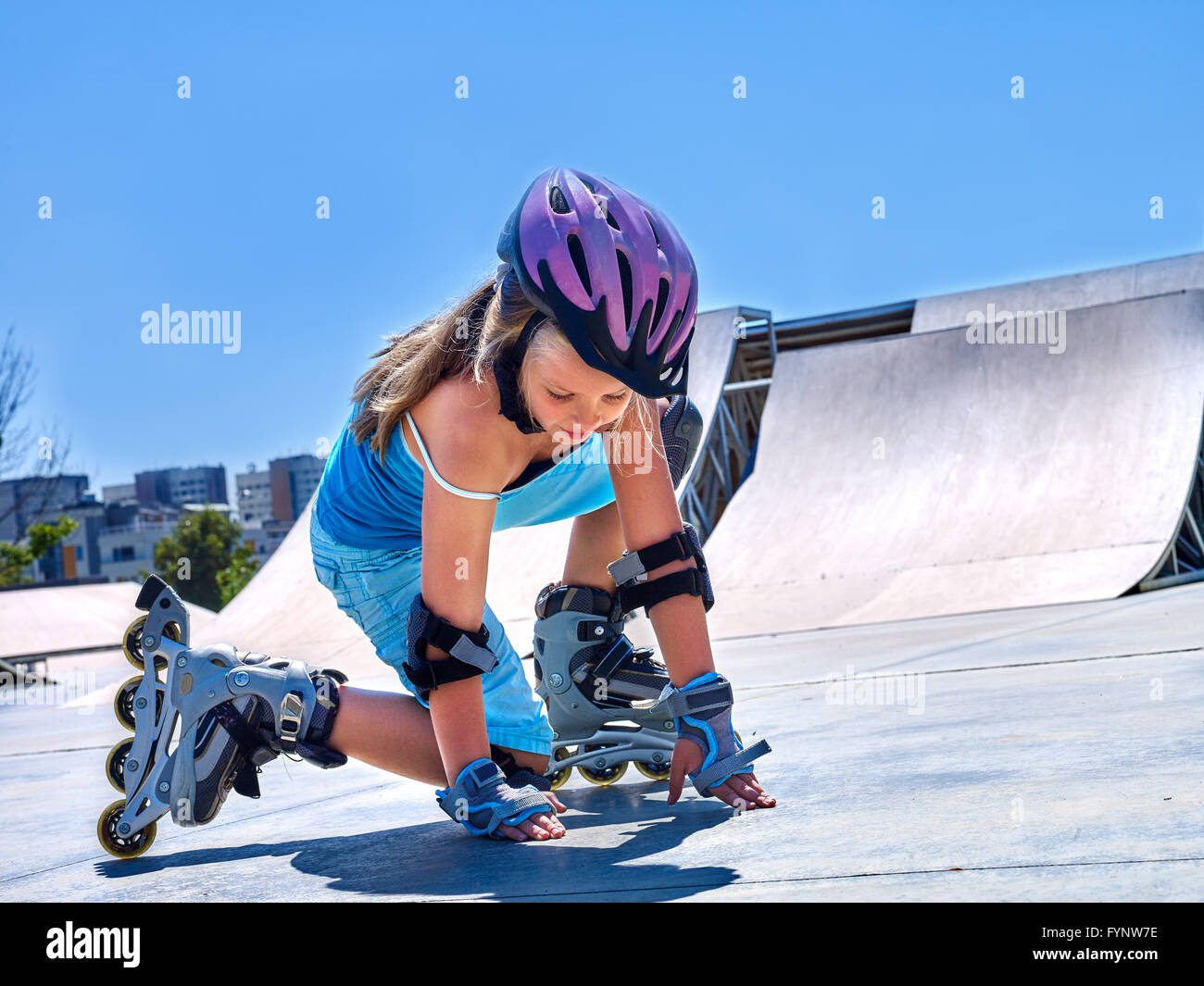 Girl riding on roller skates in skatepark Stock Photo - Alamy
