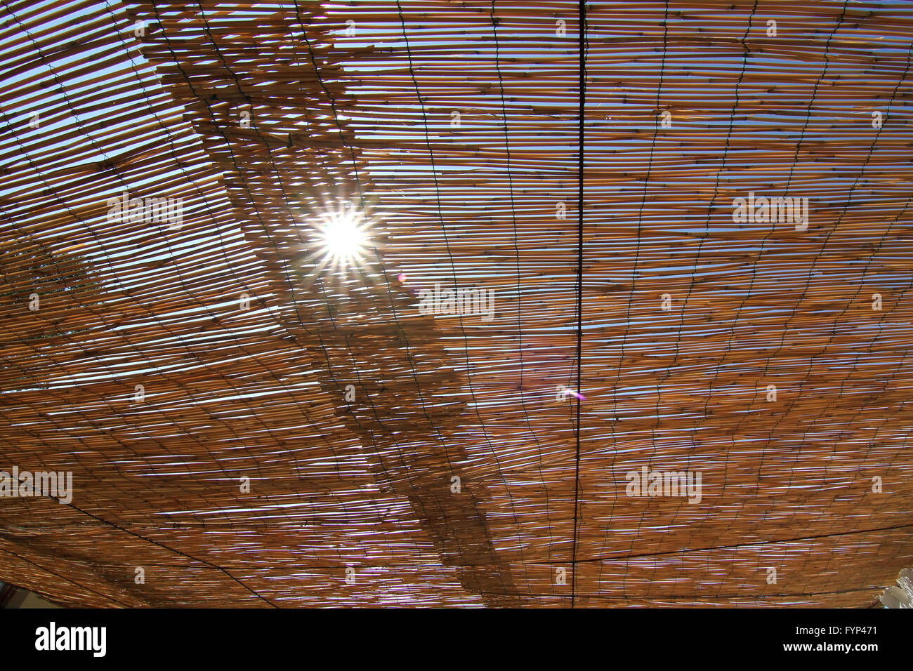 Sunshine shining through a thatched roof Stock Photo - Alamy