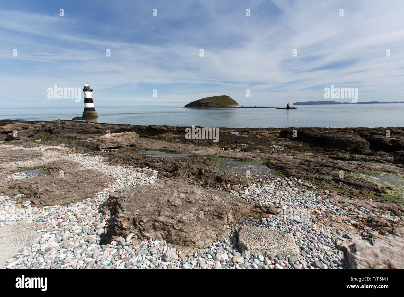 Picturesque view of Penmon Point Lighthouse, with the Menai Strait and ...