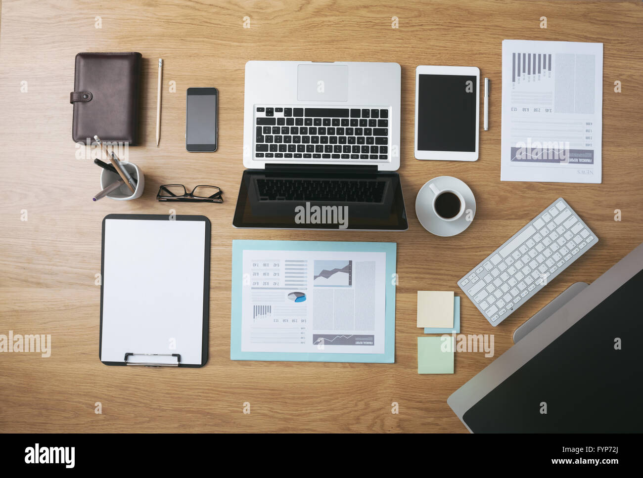 Businessman's tidy desktop and work tools with paperwork, computer ...