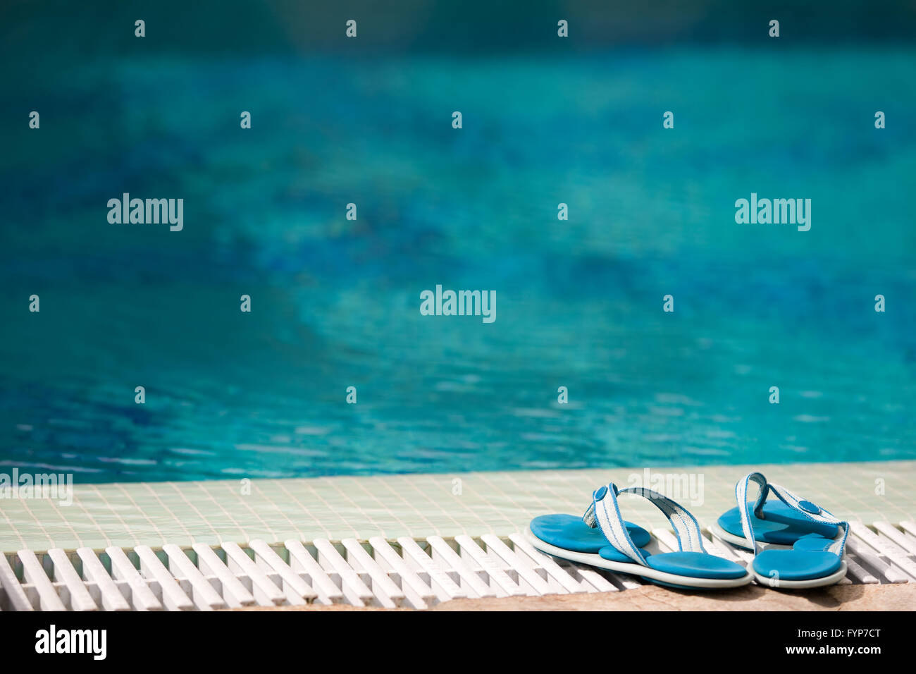 slippers near swimming pool Stock Photo - Alamy