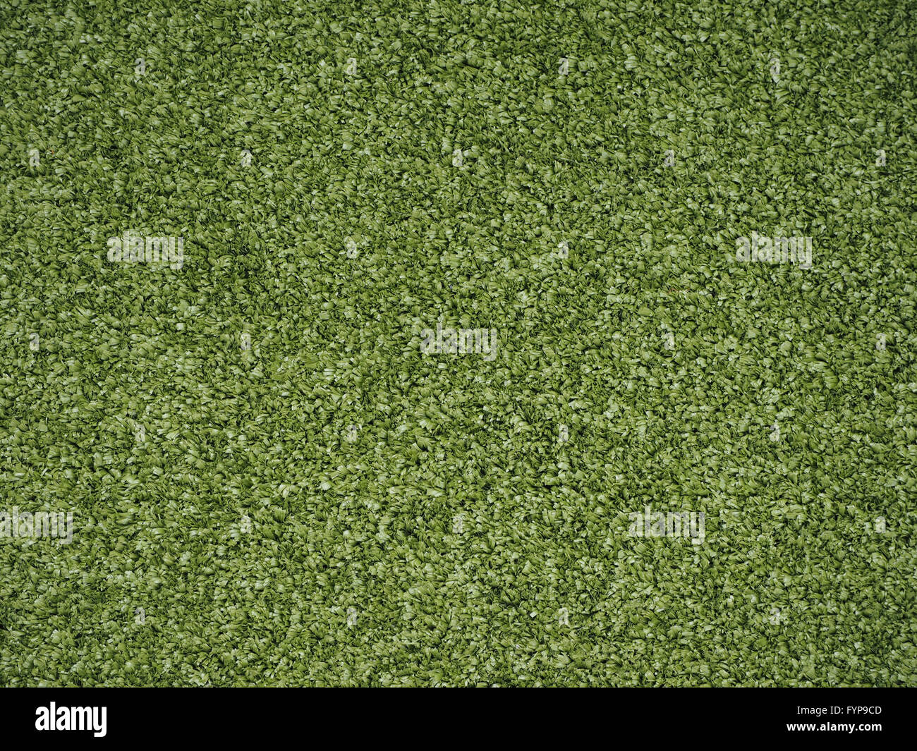 Green artificial synthetic grass meadow background Stock Photo - Alamy