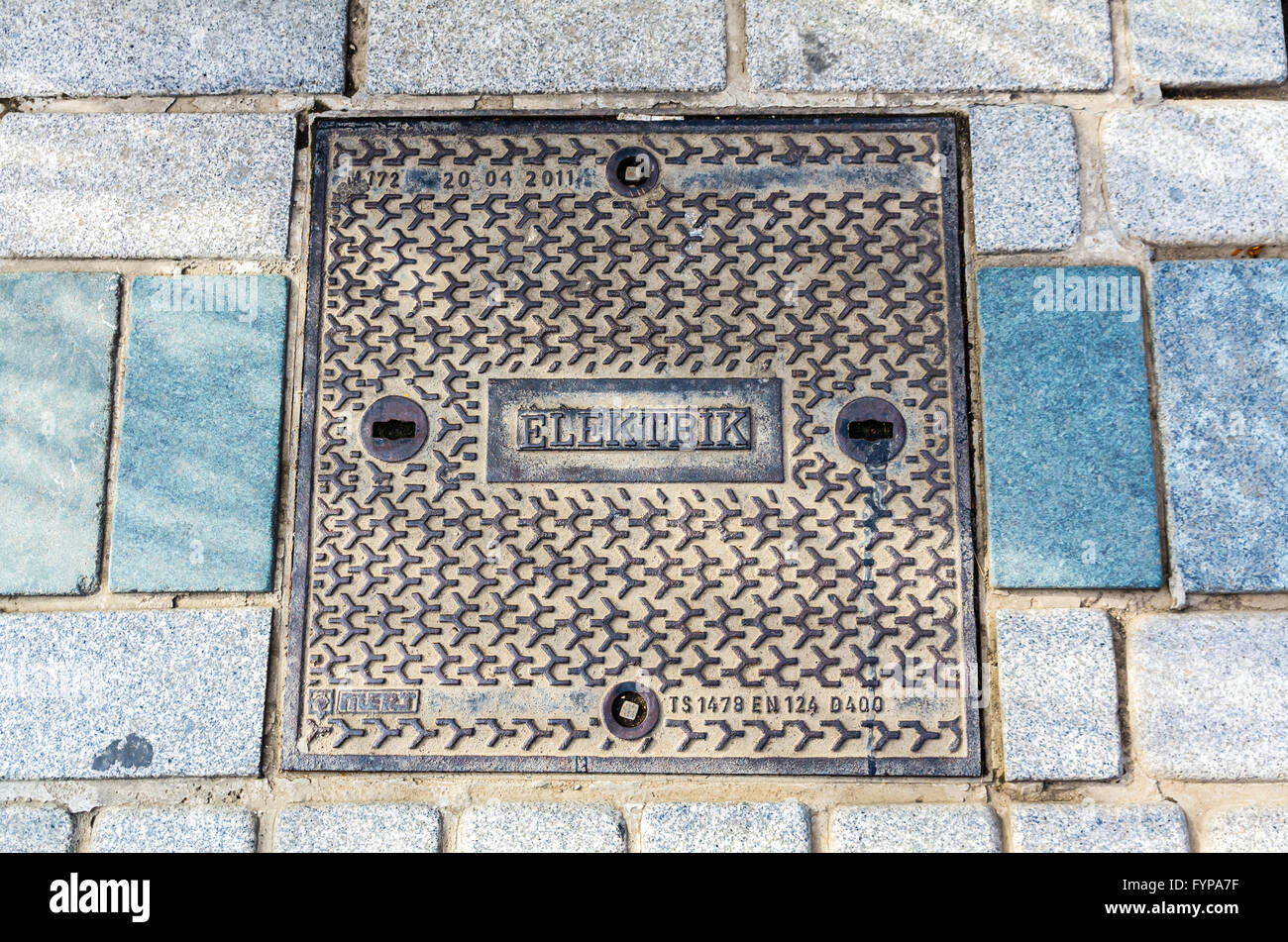 Hatch of sewage on the paving road Stock Photo - Alamy