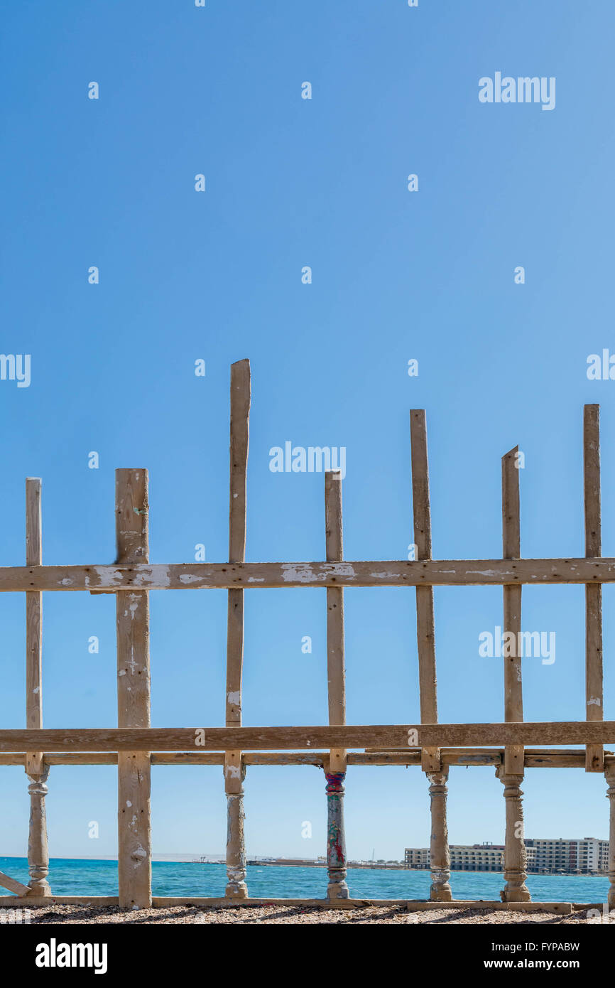 Seaside wooden fences against aqua sea and blue sky Stock Photo - Alamy
