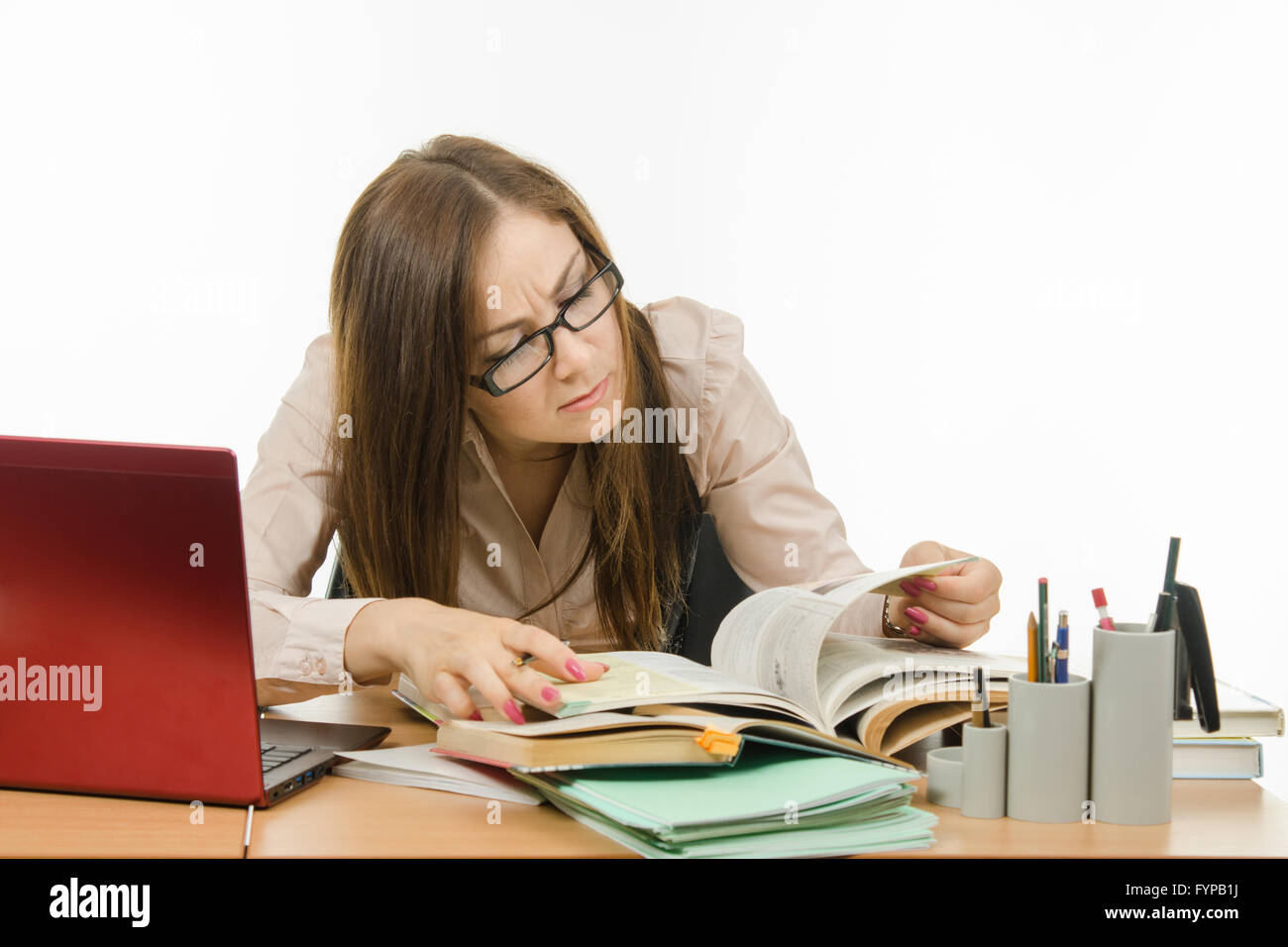 Teacher reading something in a textbook Stock Photo - Alamy