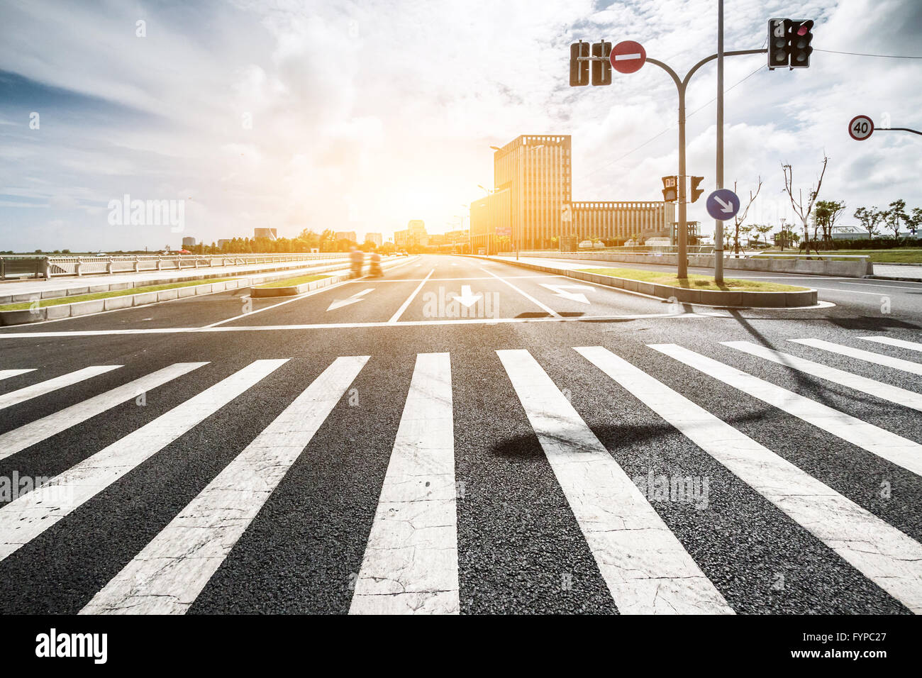 empty road with zebra crossing and direction board Stock Photo - Alamy