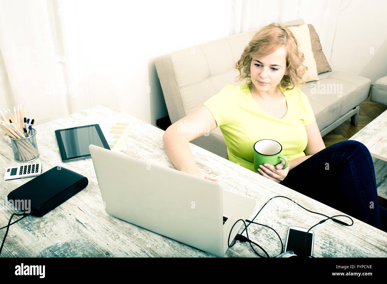 Young plus size woman working on a laptop computer Stock Photo - Alamy