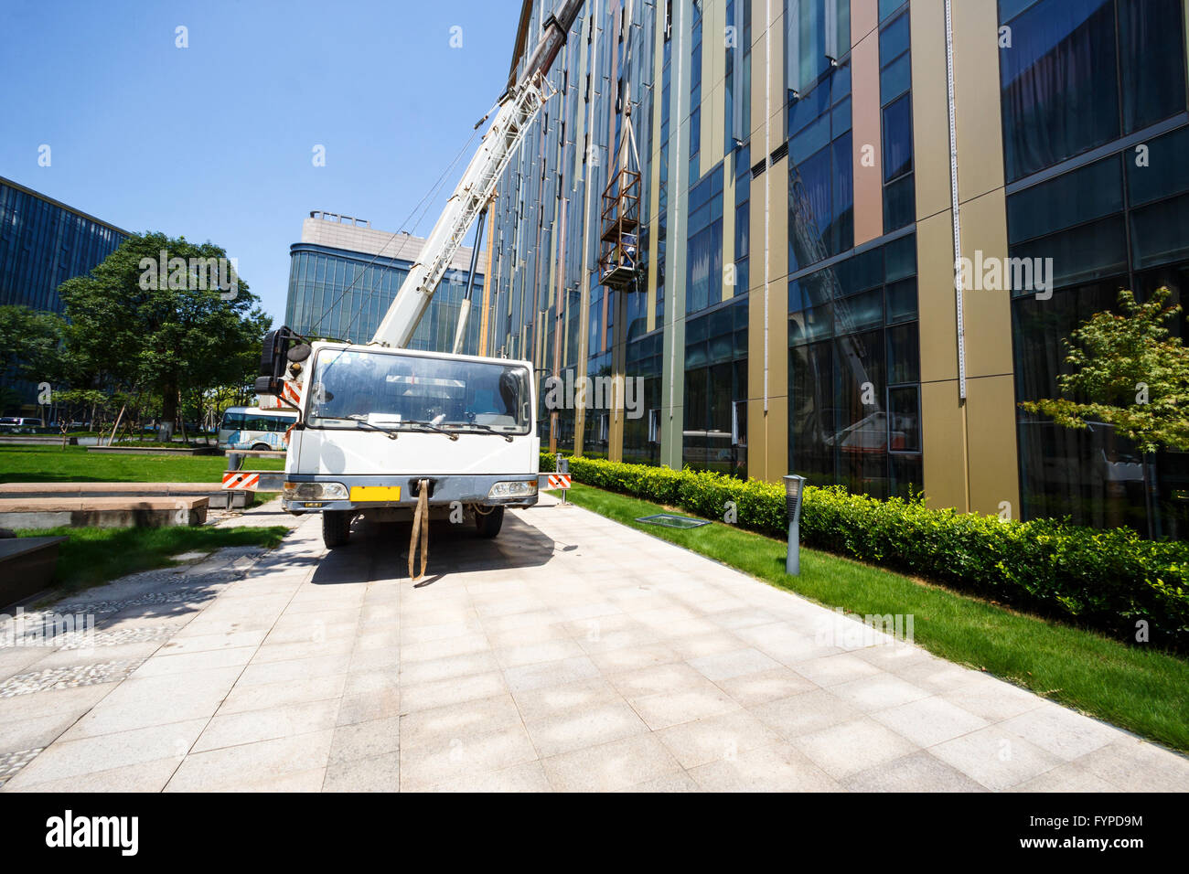 engineering van on the path outside a skyscraper Stock Photo - Alamy